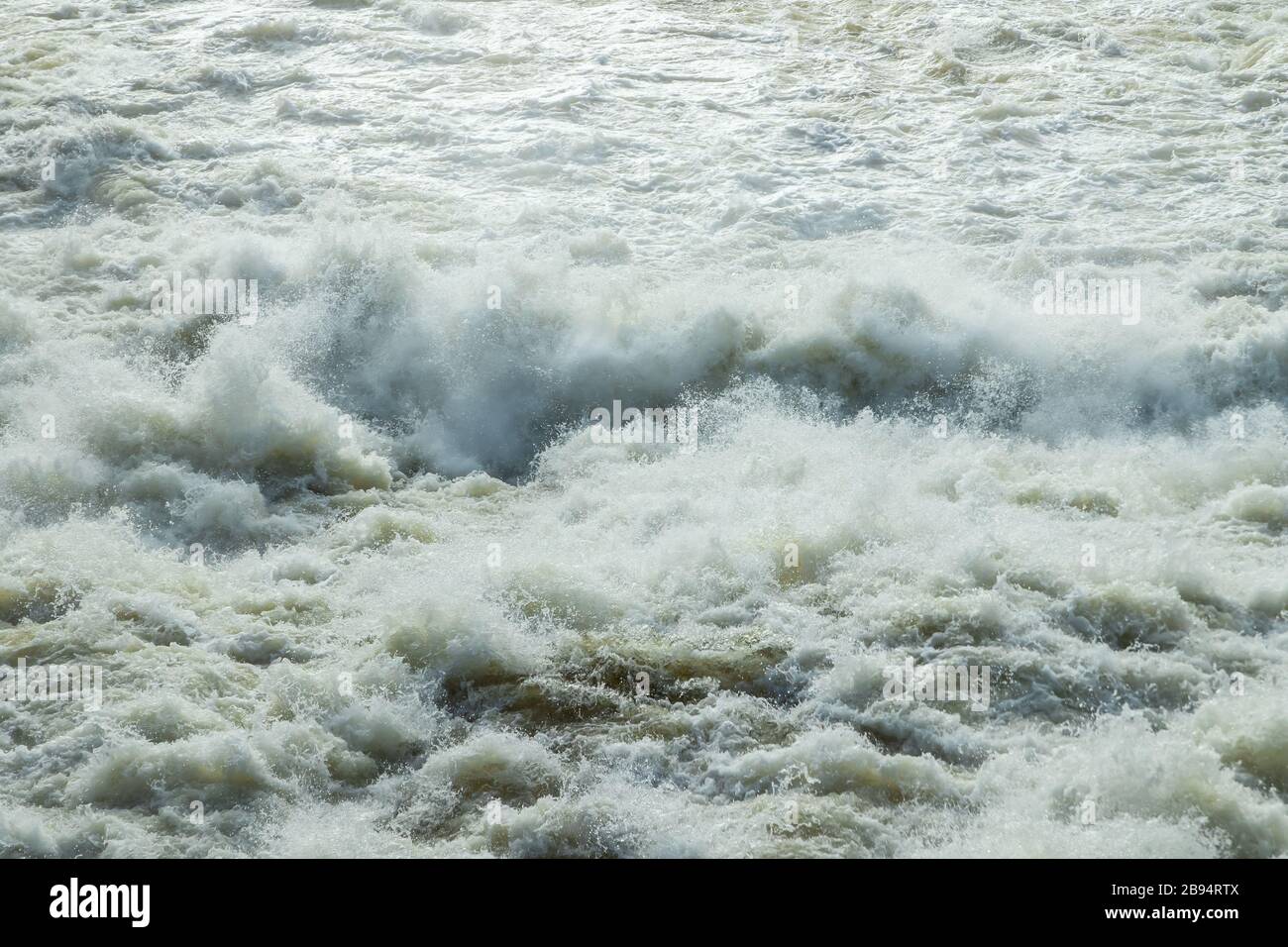 Splashing water waves on the spring fast river Stock Photo - Alamy