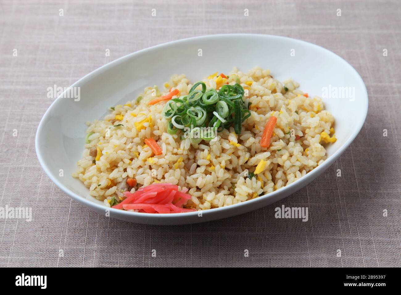 fried rice on plate isolated on table cloth Stock Photo - Alamy