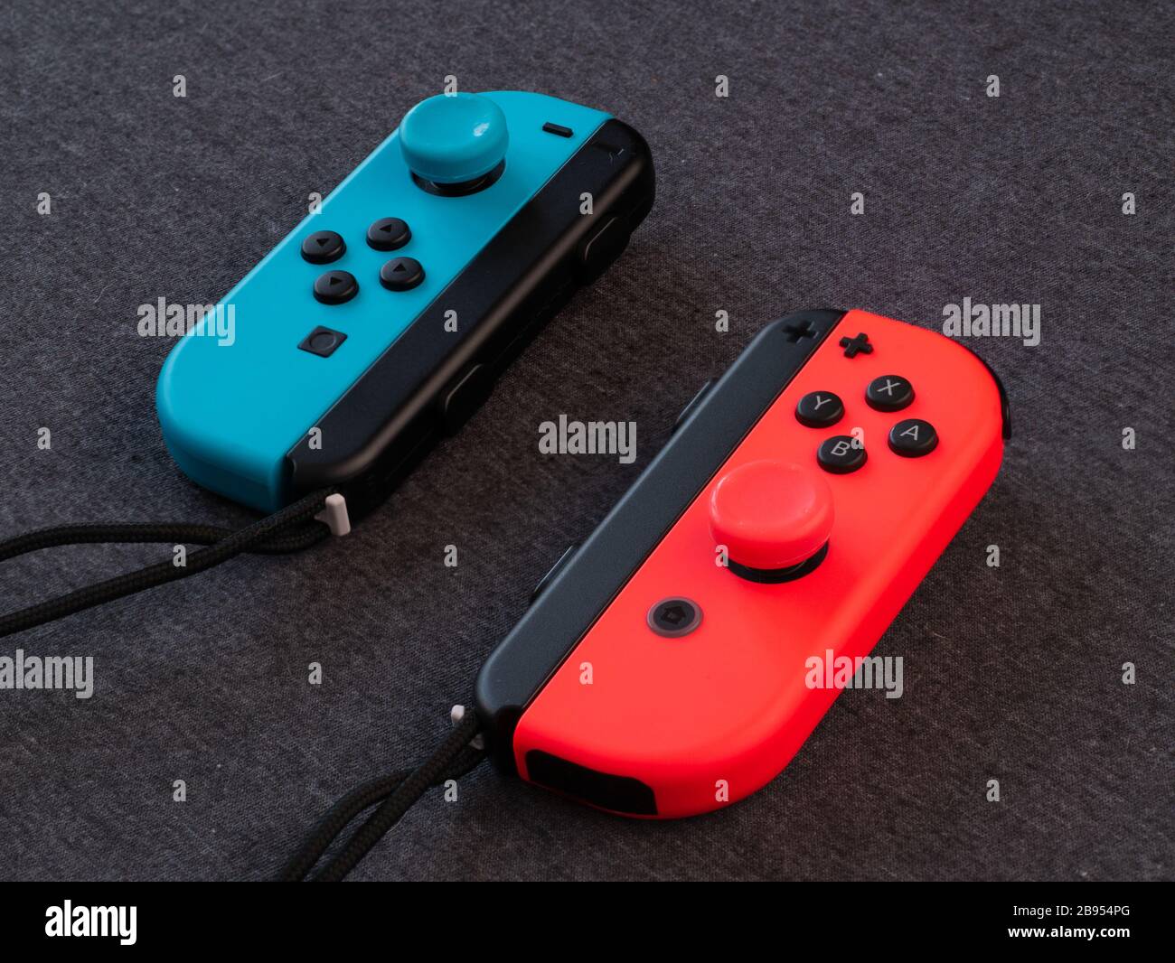 UK, March 2020: Nintendo Switch Joy Con controllers red and blue neon ...
