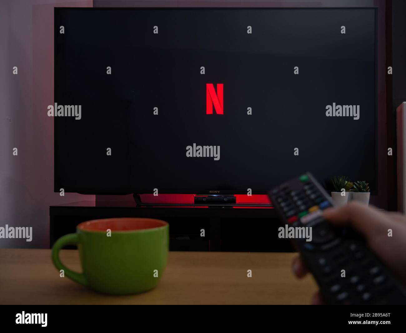 UK, March 2020: TV Television Netflix N on screen with remote Stock ...