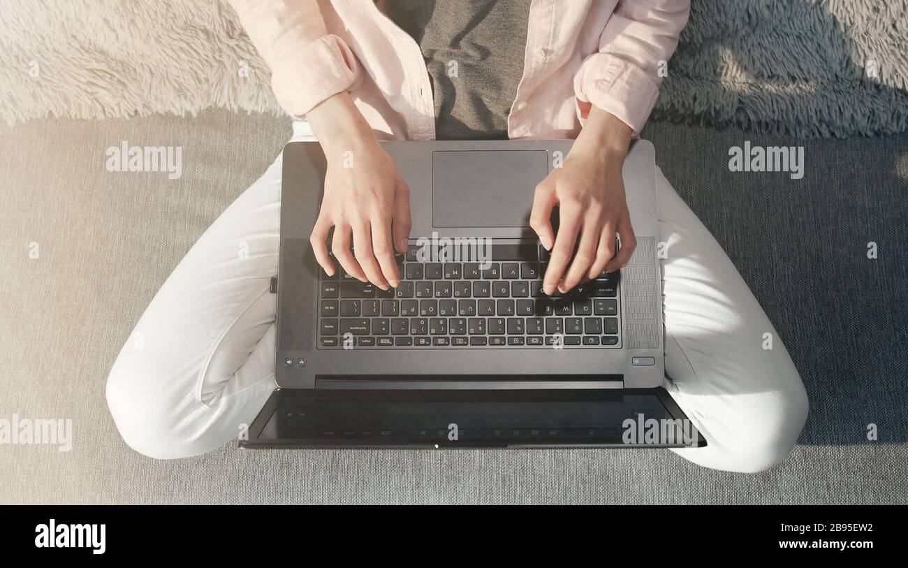 Lady using laptop cropped shot Stock Photo - Alamy