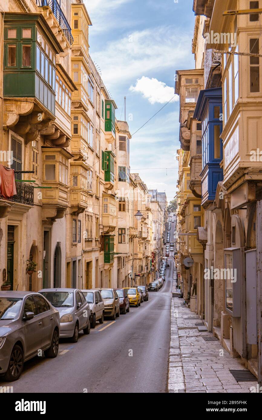 Malta, Typical narrow streets with colorful balconies in Valletta ...