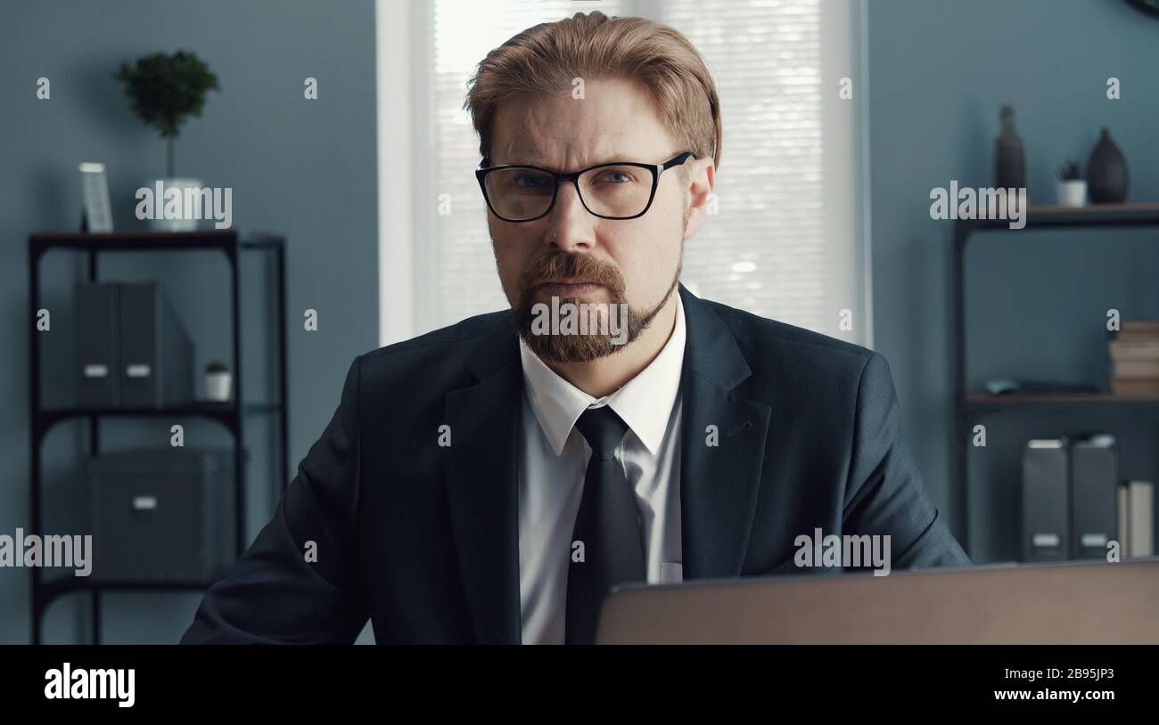 Businessman at workplace portrait Stock Photo - Alamy