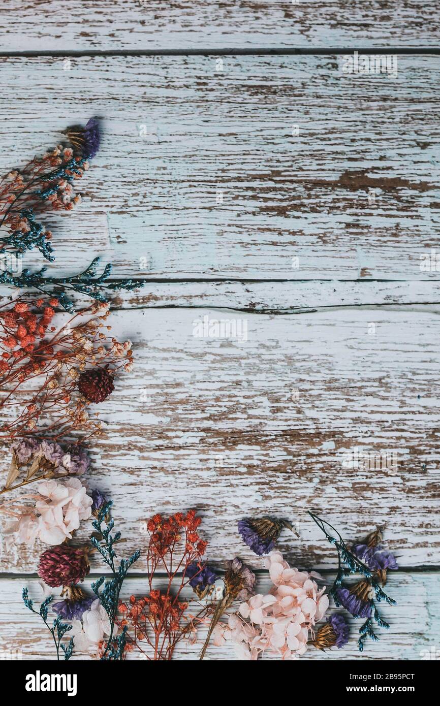 Rustic Wood Background with Colorful Dried Flowers Stock Photo - Alamy