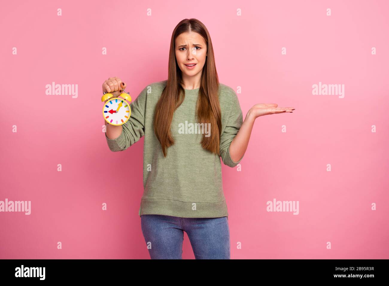 Portrait of upset sad girl hold clock disappoint her missed work ...