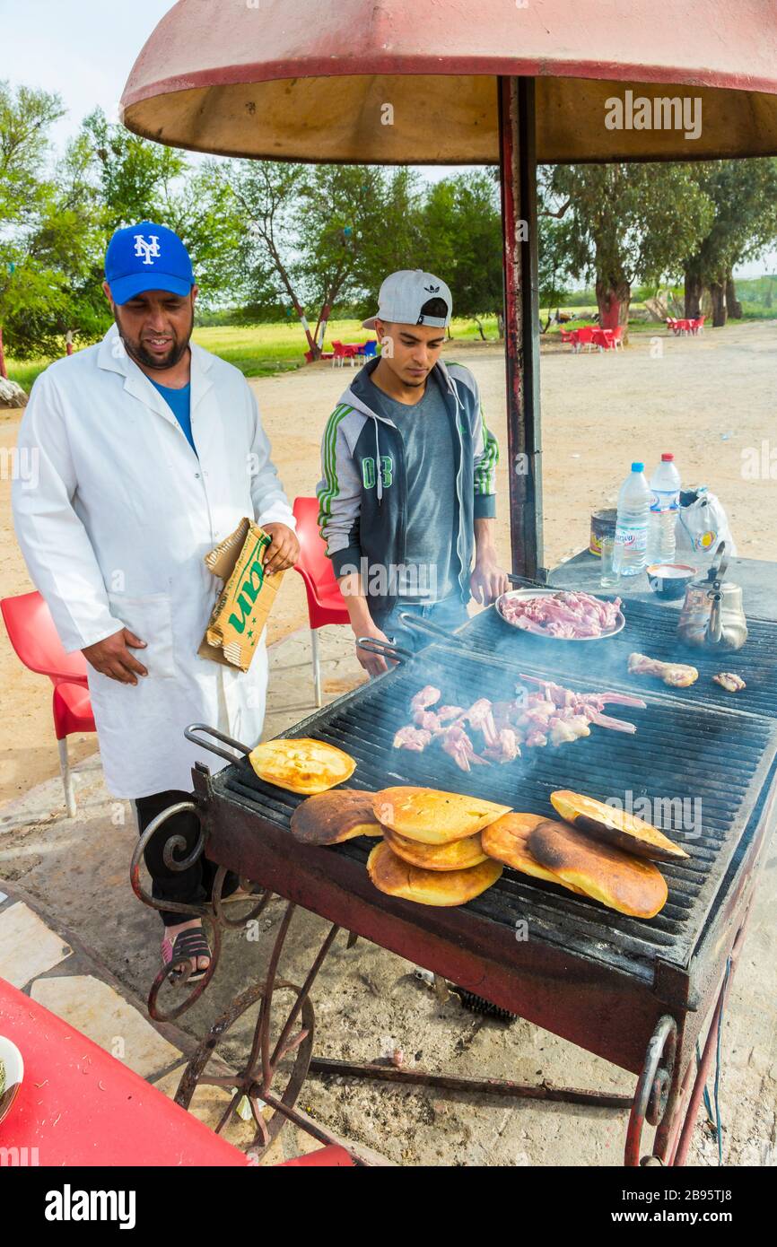Cooking lamb in a road food stall Stock Photo - Alamy