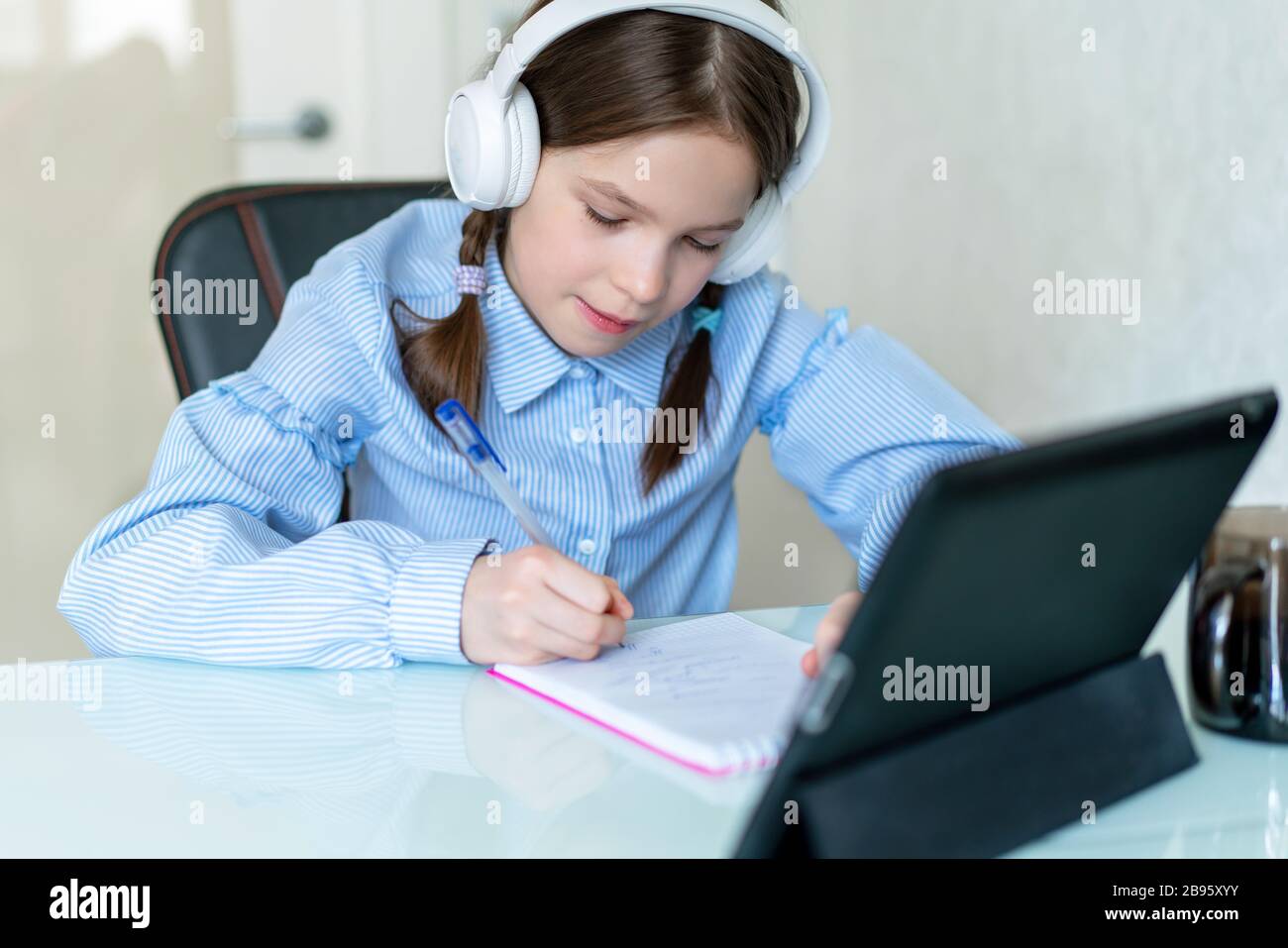 Young girl learn by tablet at home. Distance learning in quarantine ...