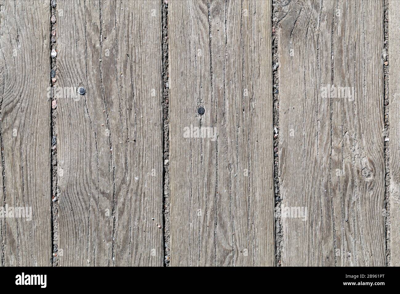 Weathered wooden grey outdoor porch floor. No people. Colorful texture ...