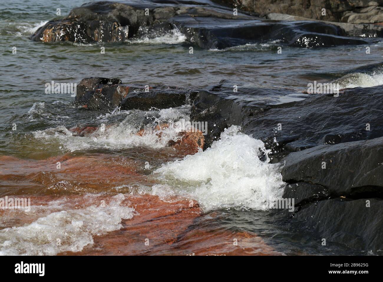 Waves hitting rocks in Helsinki, Finland. Beautiful photo representing ...