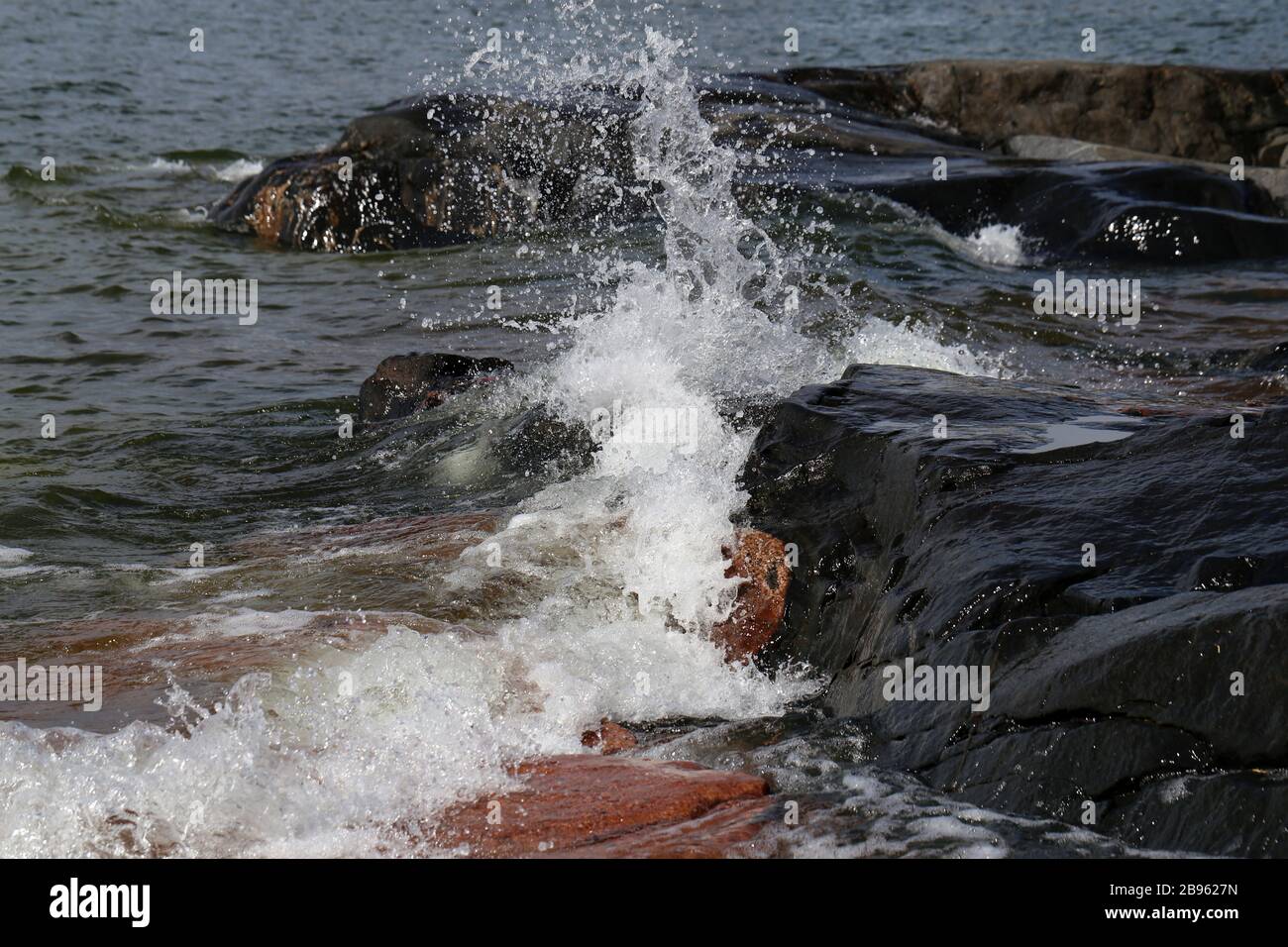 Waves hitting rocks in Helsinki, Finland. Beautiful photo representing ...