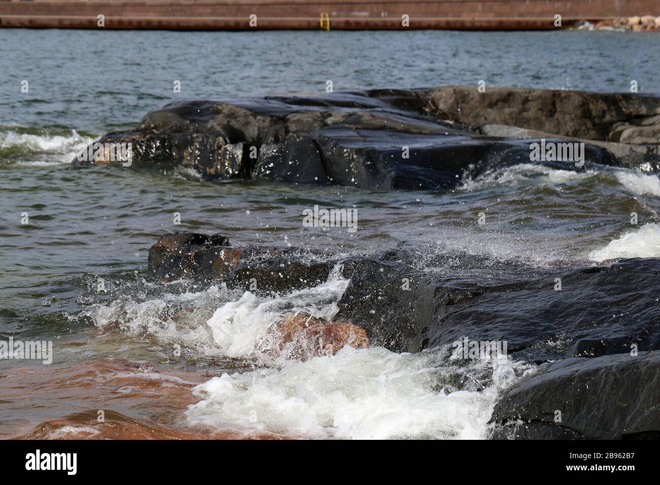 Waves hitting rocks in Helsinki, Finland. Beautiful photo representing ...