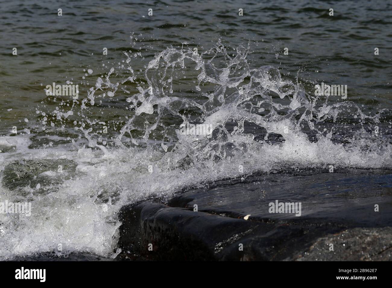 Waves hitting rocks in Helsinki, Finland. Beautiful photo representing ...