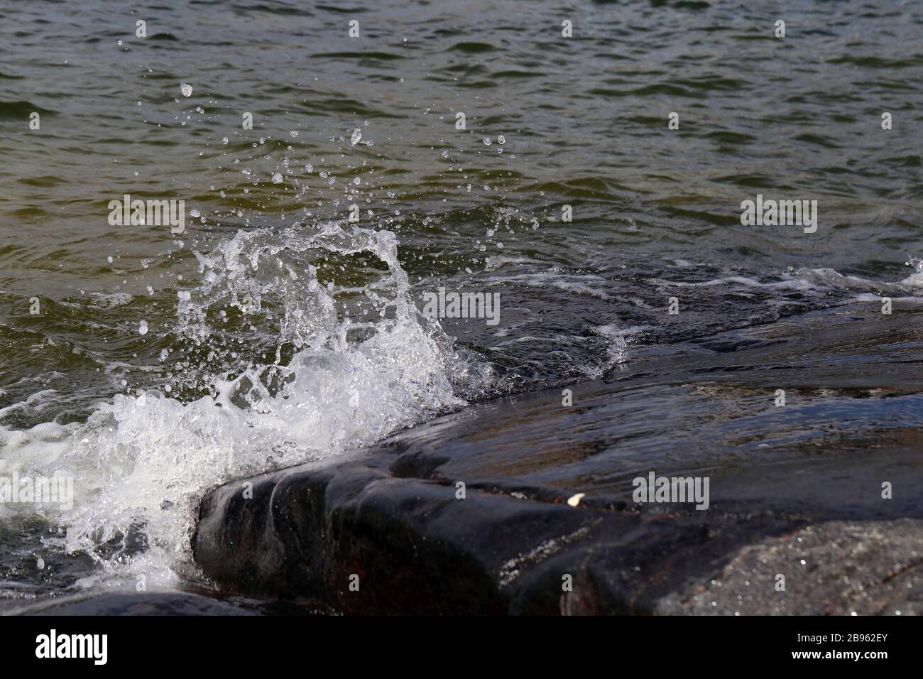 Waves hitting rocks in Helsinki, Finland. Beautiful photo representing ...