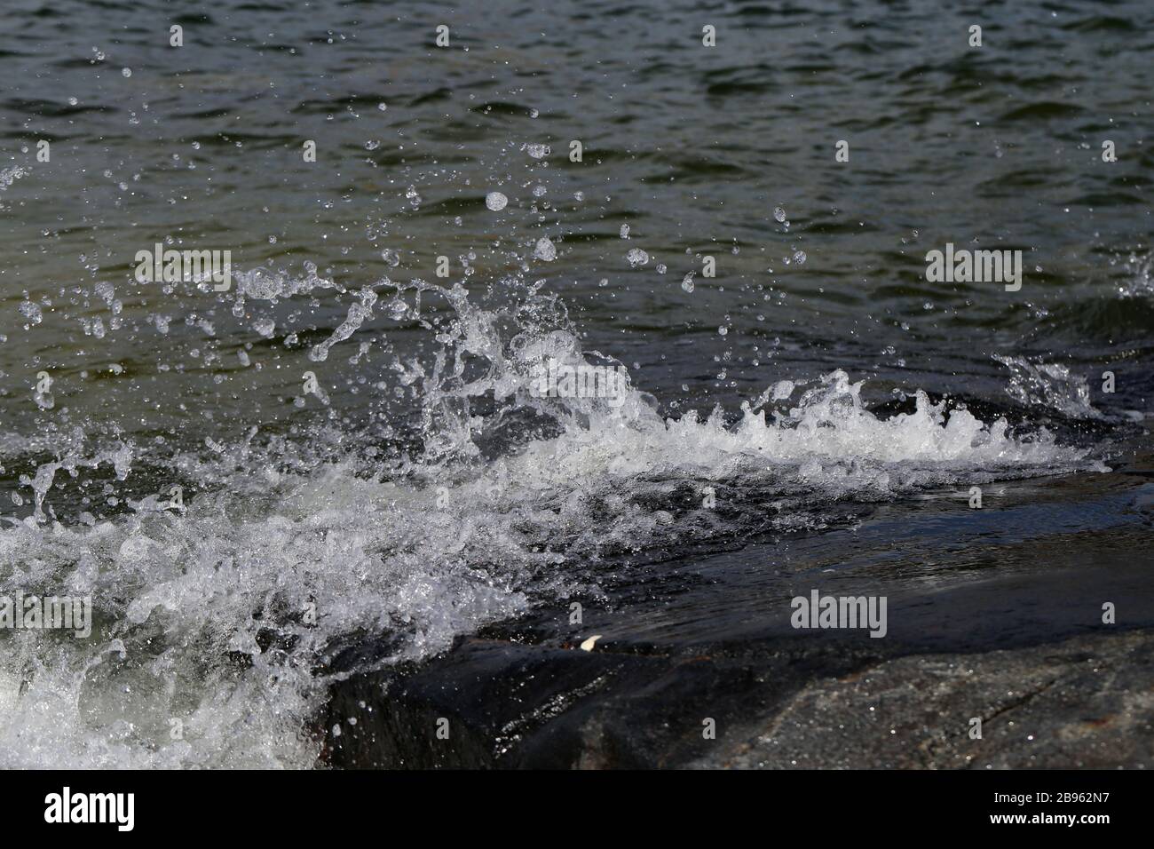 Waves hitting rocks in Helsinki, Finland. Beautiful photo representing ...