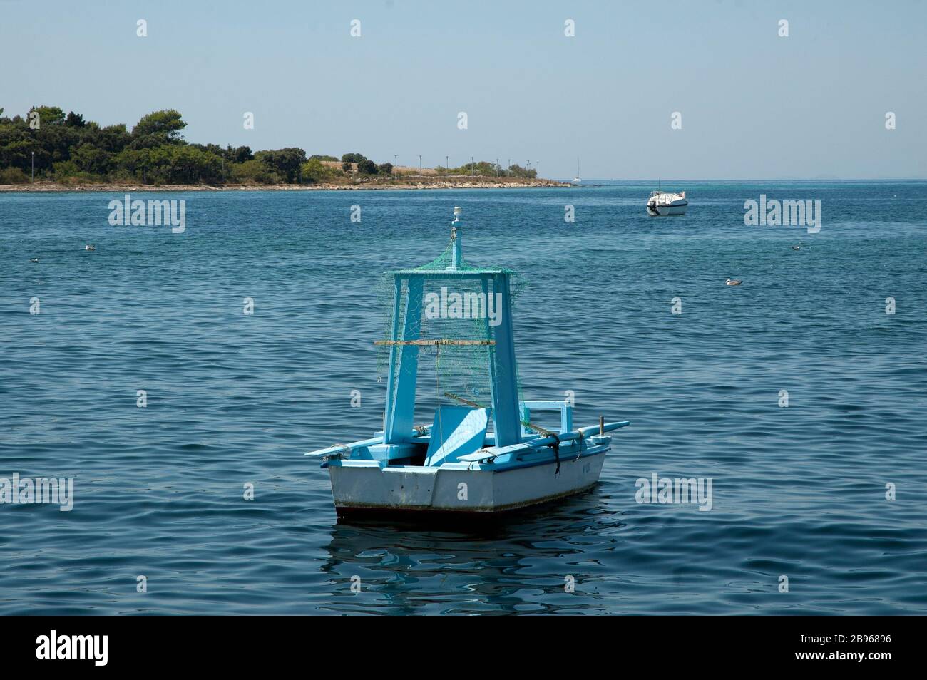 Small boat at sea hi-res stock photography and images - Alamy
