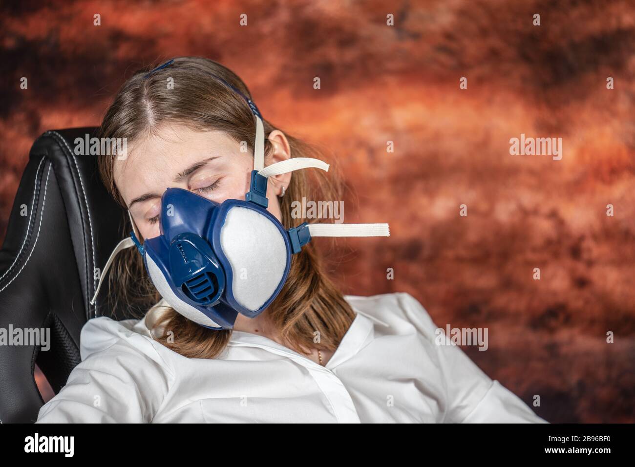 Woman in a gas mask sleeping on a chair. Coronovirus Quarantine, Stay ...