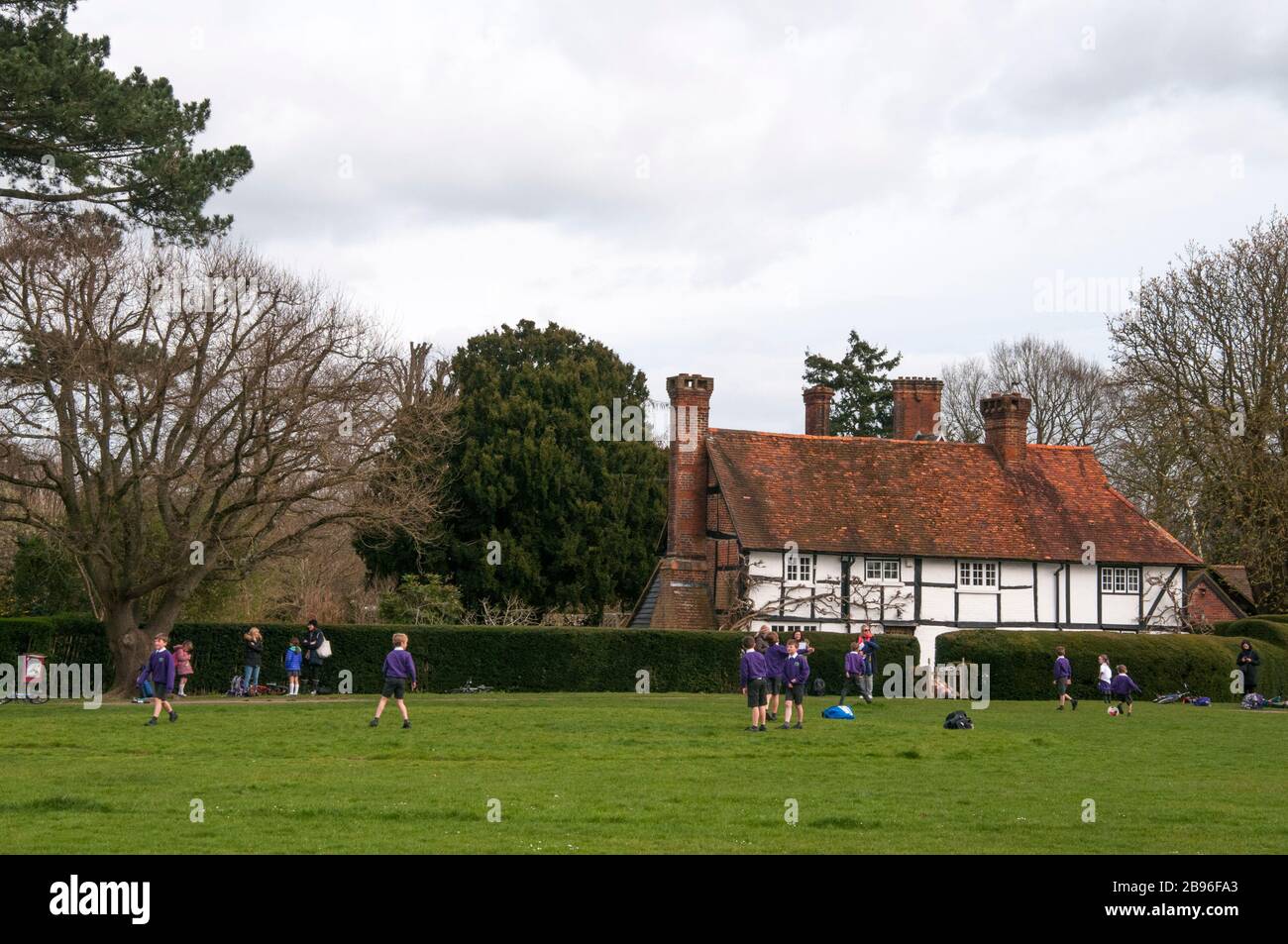 Children playing on the village green at Brockham, Surrey, England ...