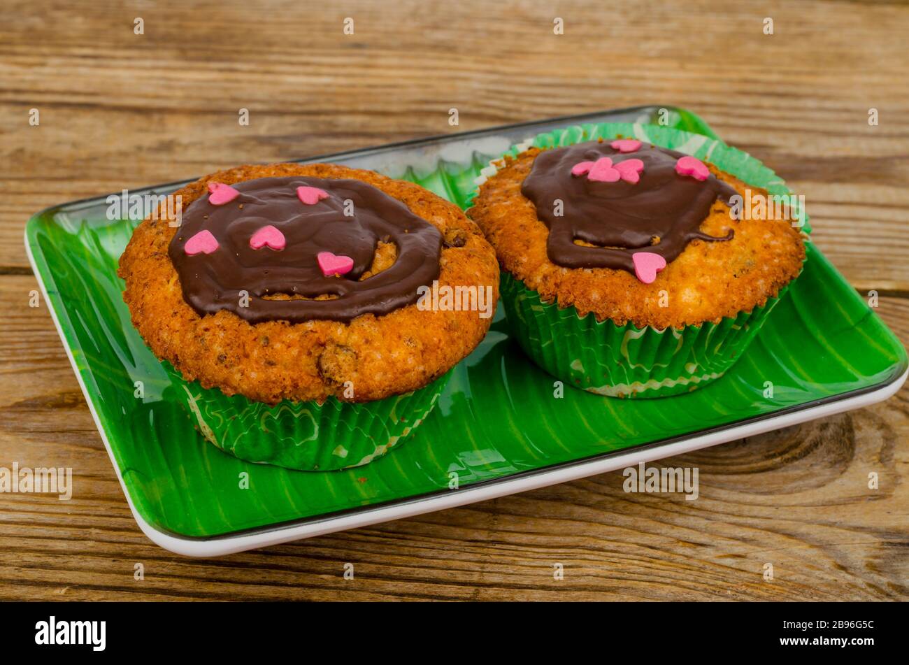 Homemade cakes. Two delicious vanilla sweet muffins with chocolate ...
