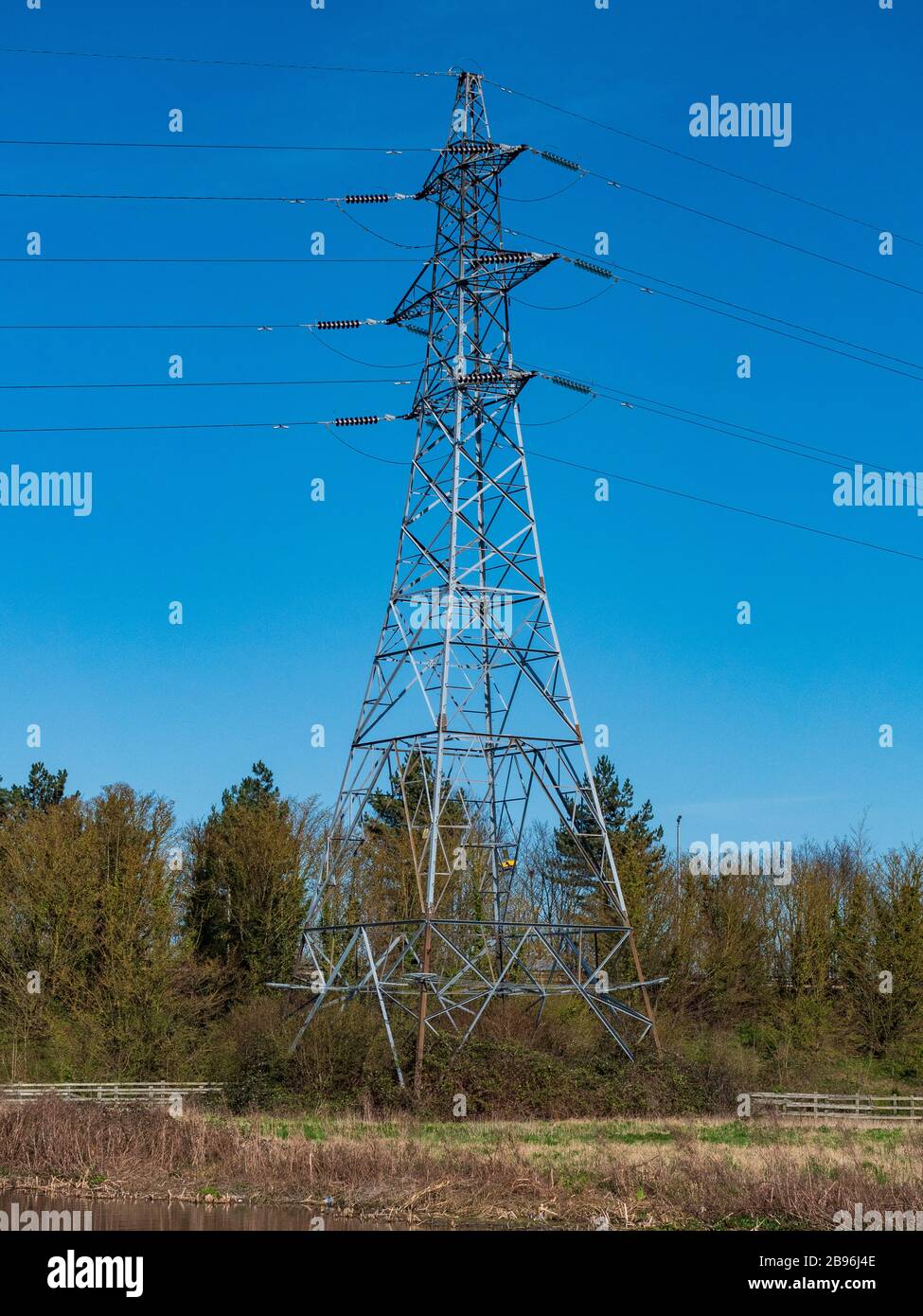 Electricity Pylon against a blue sky. Cambridgeshire, England, UK Stock ...