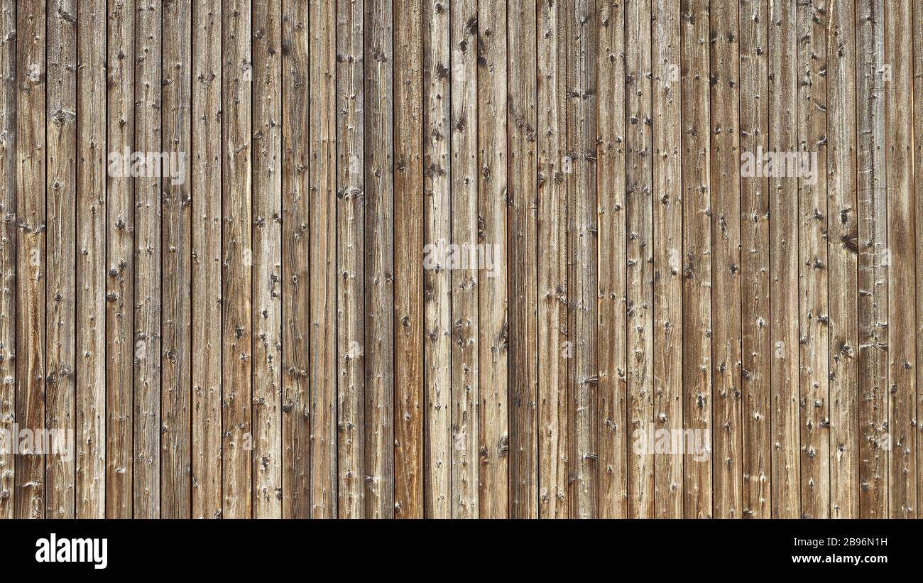 Timber wood wall of an old barn. Beautiful weathered vertical planks ...