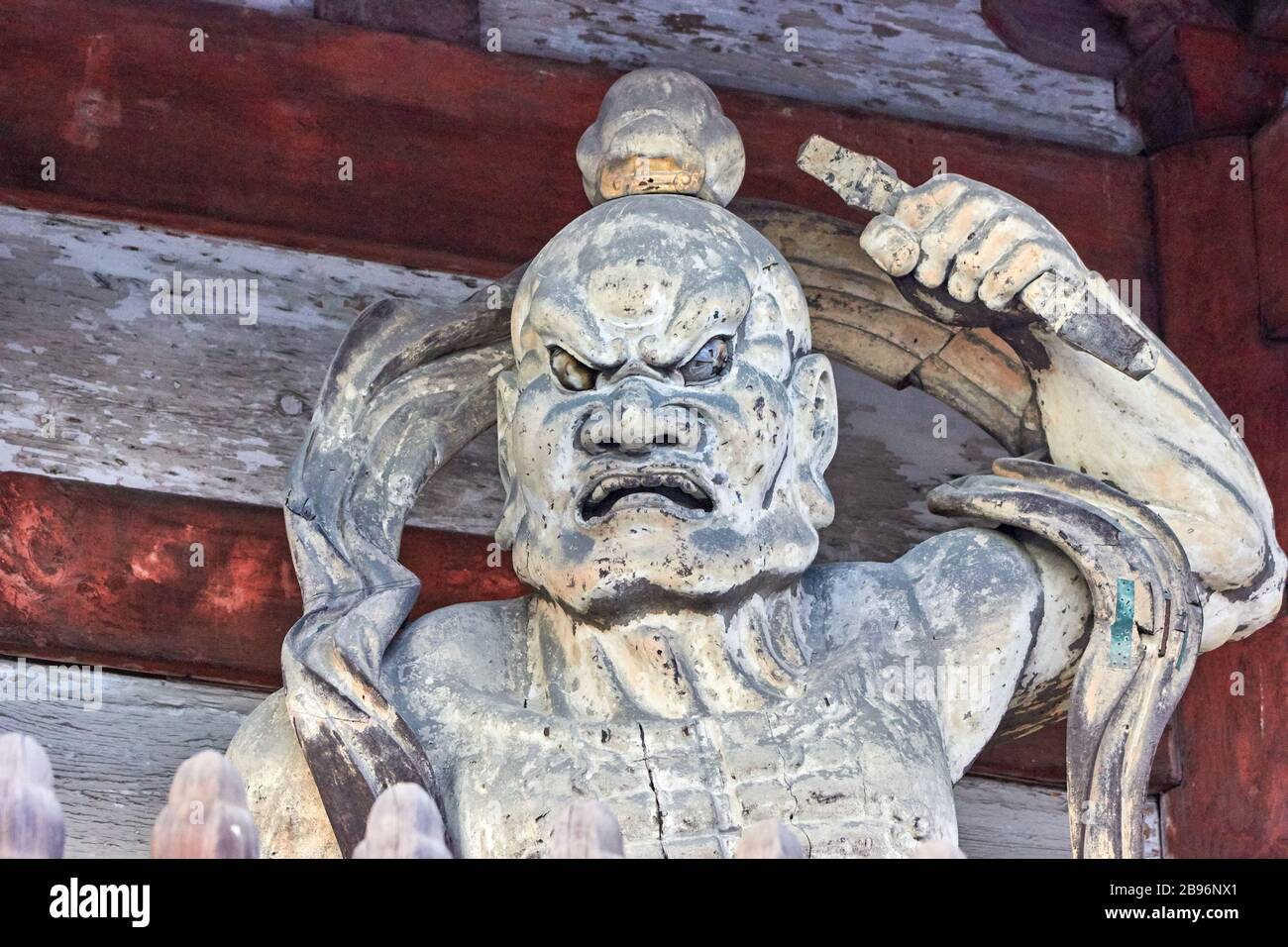 Ancient angry sculpture near the temple entrance Stock Photo - Alamy