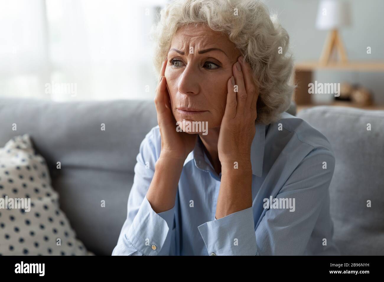 Sad concerned elderly woman hi-res stock photography and images - Alamy