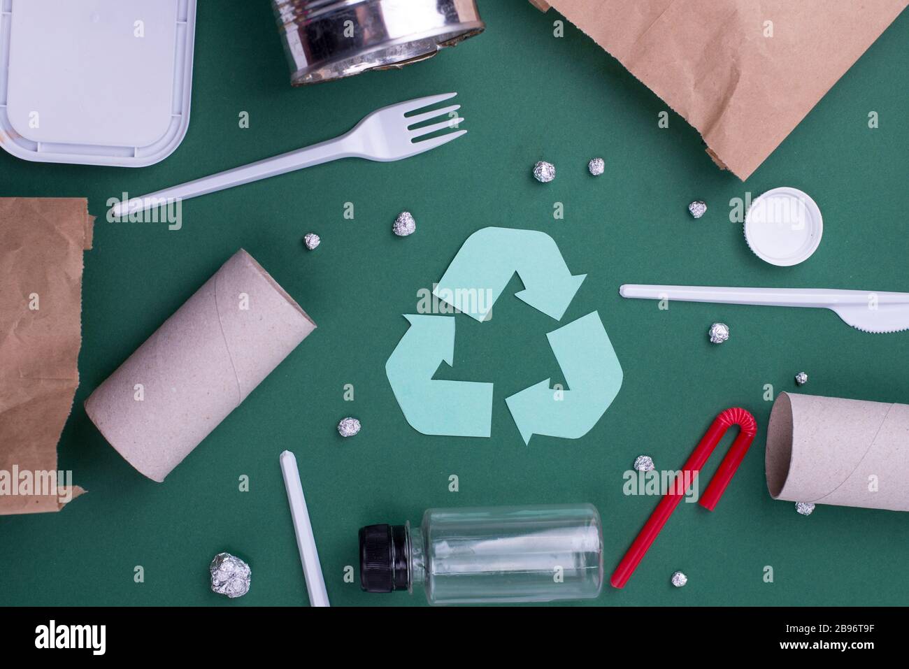 Reuse reduce recycle flat lay concept with plastic, paper, and ...
