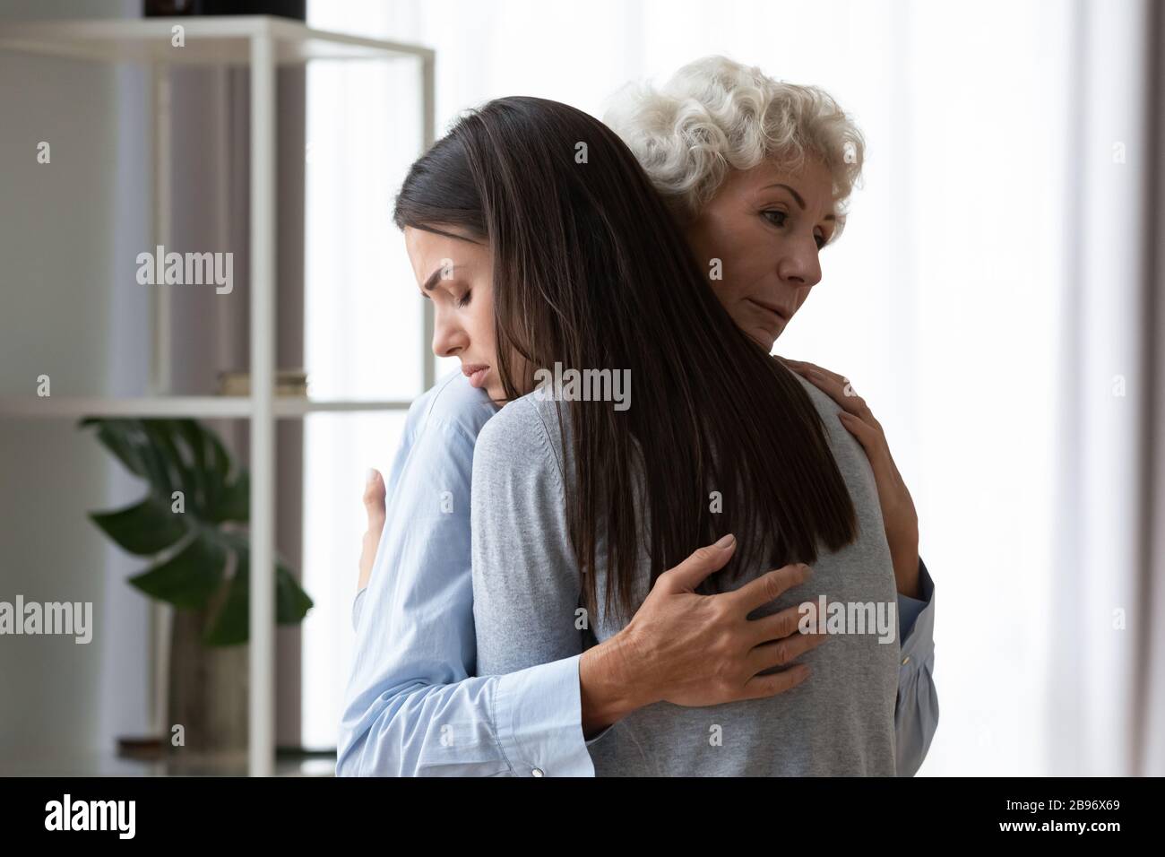 Supportive mom hug sad depressed adult daughter Stock Photo - Alamy