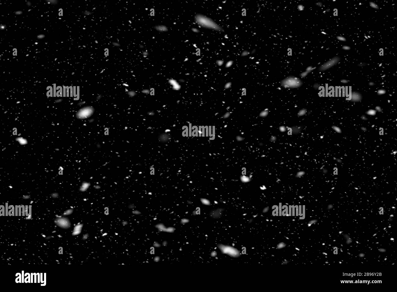 Snowfall on black background Stock Photo - Alamy