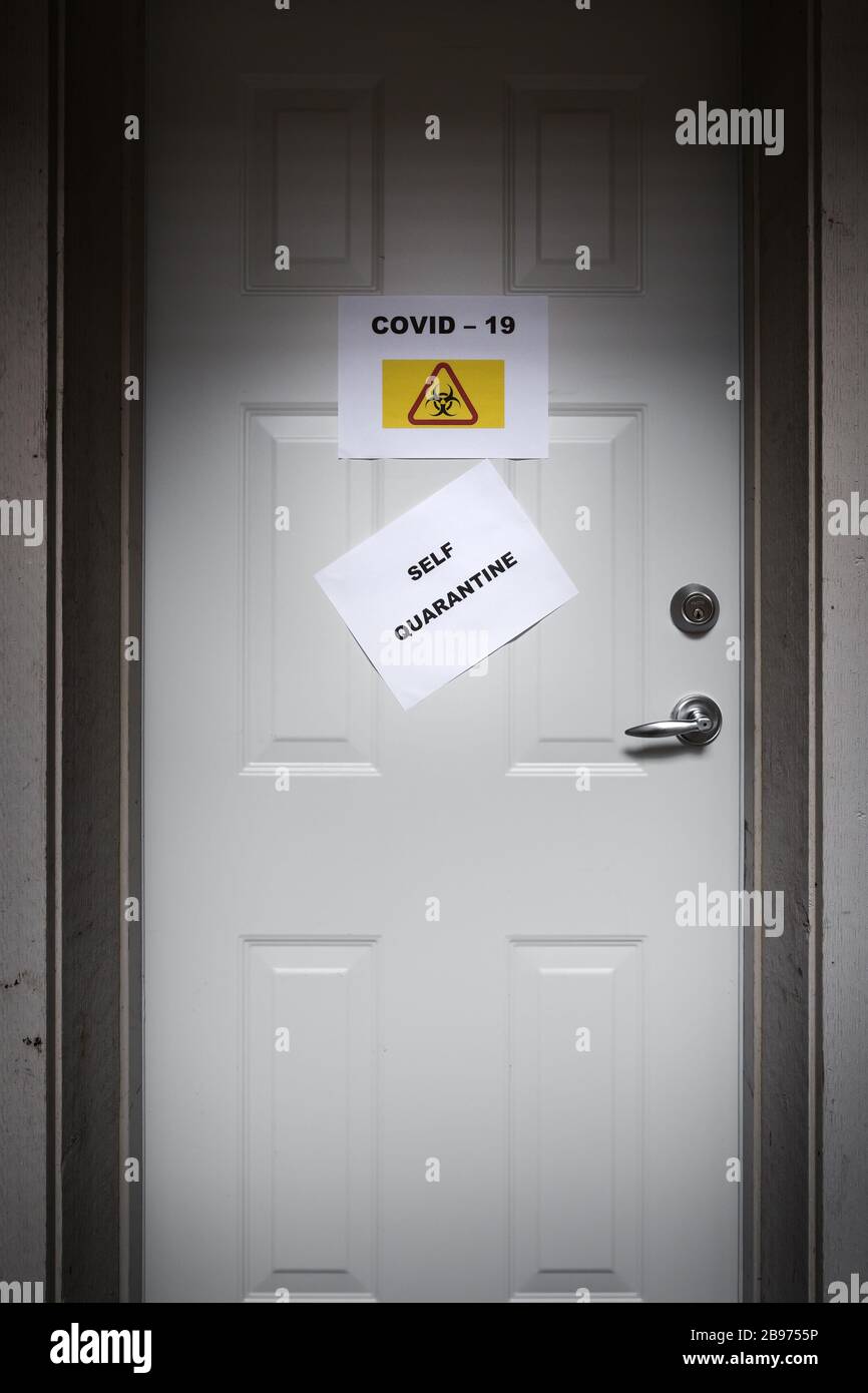 A self isolating residence with a quarantine sign on the front door ...