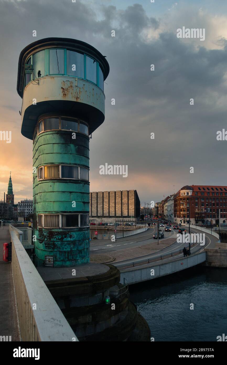 Historic bridge tower with dramatic sky and sunset in Copenhagen ...