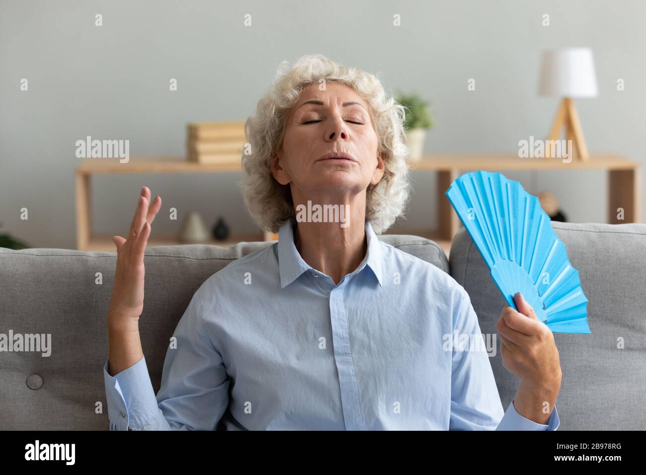 Overheated elderly woman hand hi-res stock photography and images - Alamy