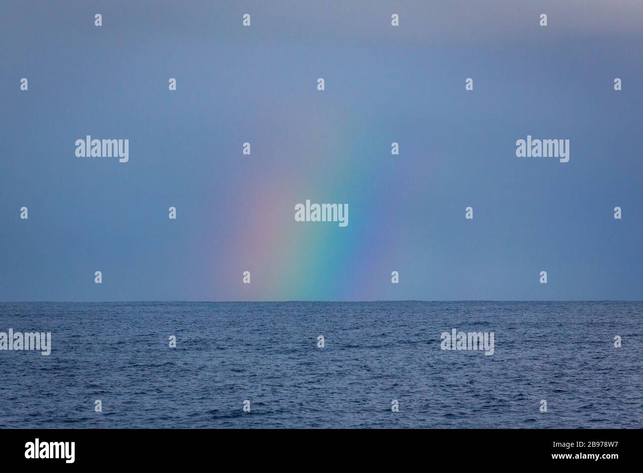Colorful rainbow over the island Grasøya at the Nowegian Sea Stock ...