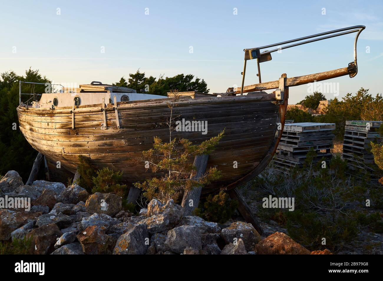 Antique wood sailing boat abandoned ashore in the mediterranean ...