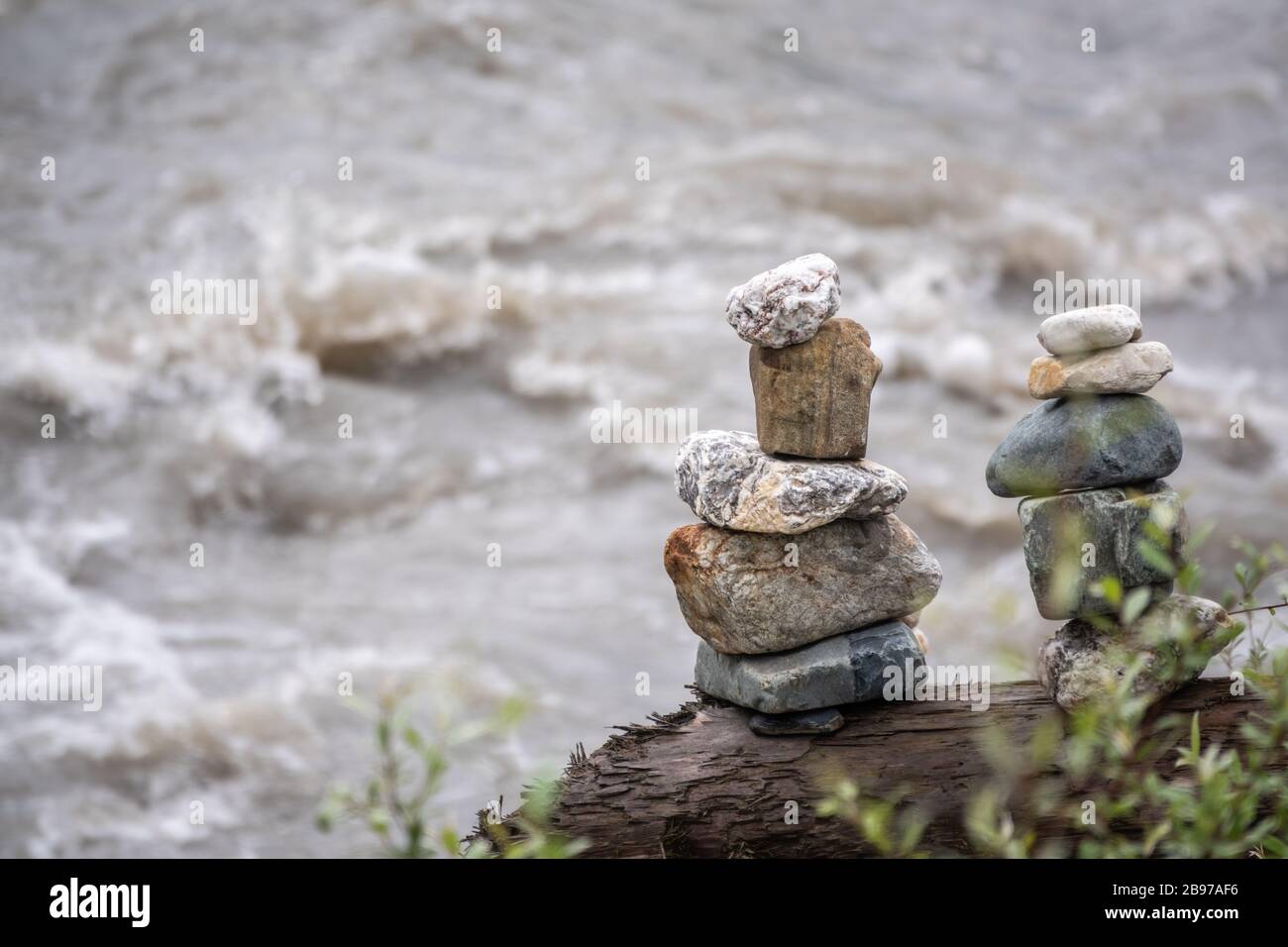 Balancing stones in equilibrium. Meditation and rest on the bank of the ...
