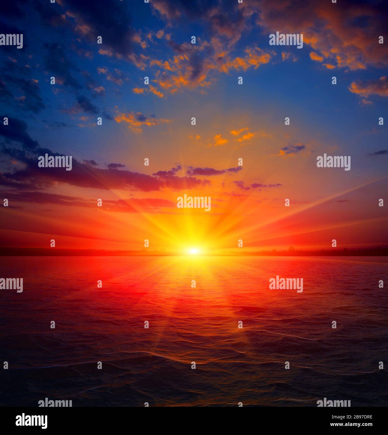 Nice sunset over lake surface Stock Photo - Alamy