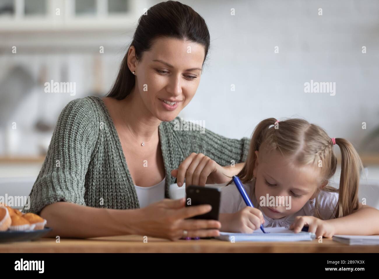 Mom and daughter have fun enjoying weekend together Stock Photo - Alamy