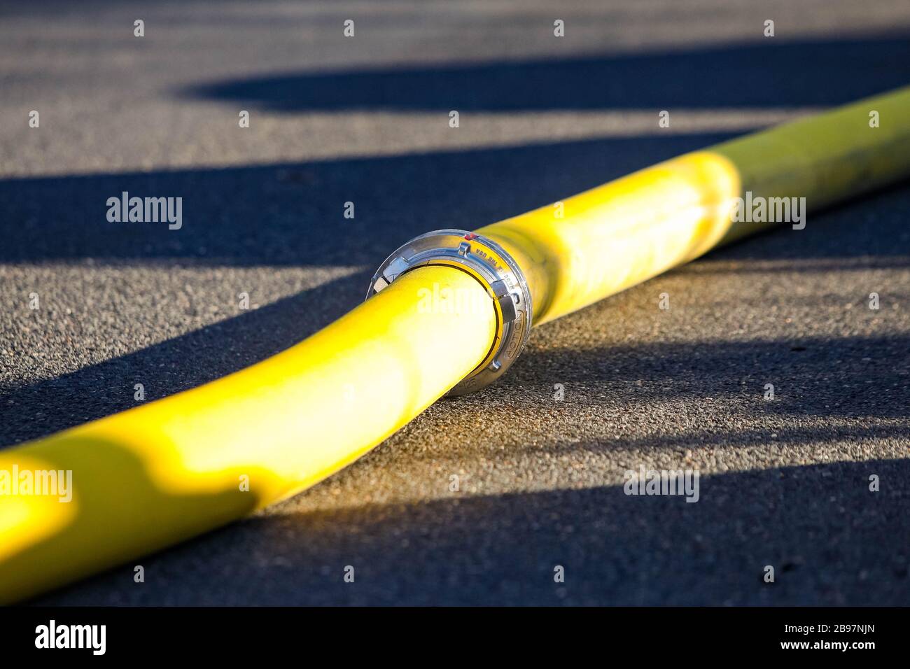 Water supply hose pipe for firefighters on the road nobody Stock Photo ...