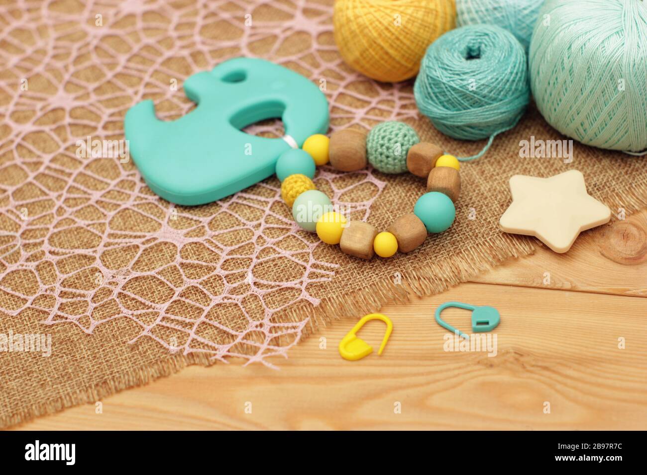 crochet wood and silicon rattle Stock Photo - Alamy