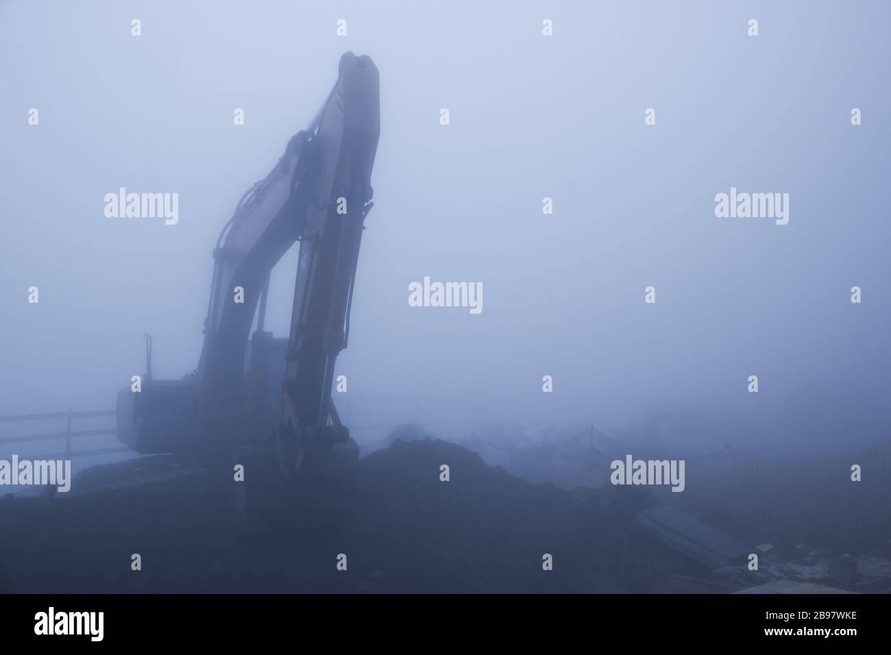 Foggy day and excavating works Stock Photo - Alamy