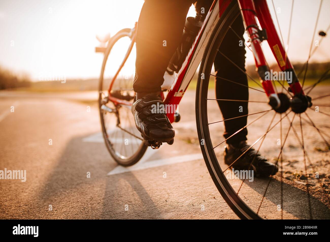 Cyclist on front wheel of mountain bike hi-res stock photography and ...