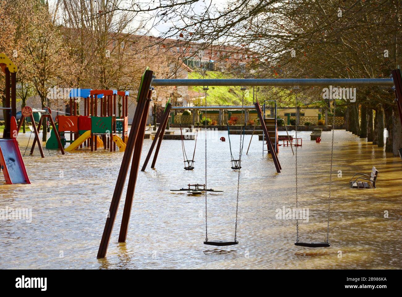 swings in the flooded park Stock Photo - Alamy