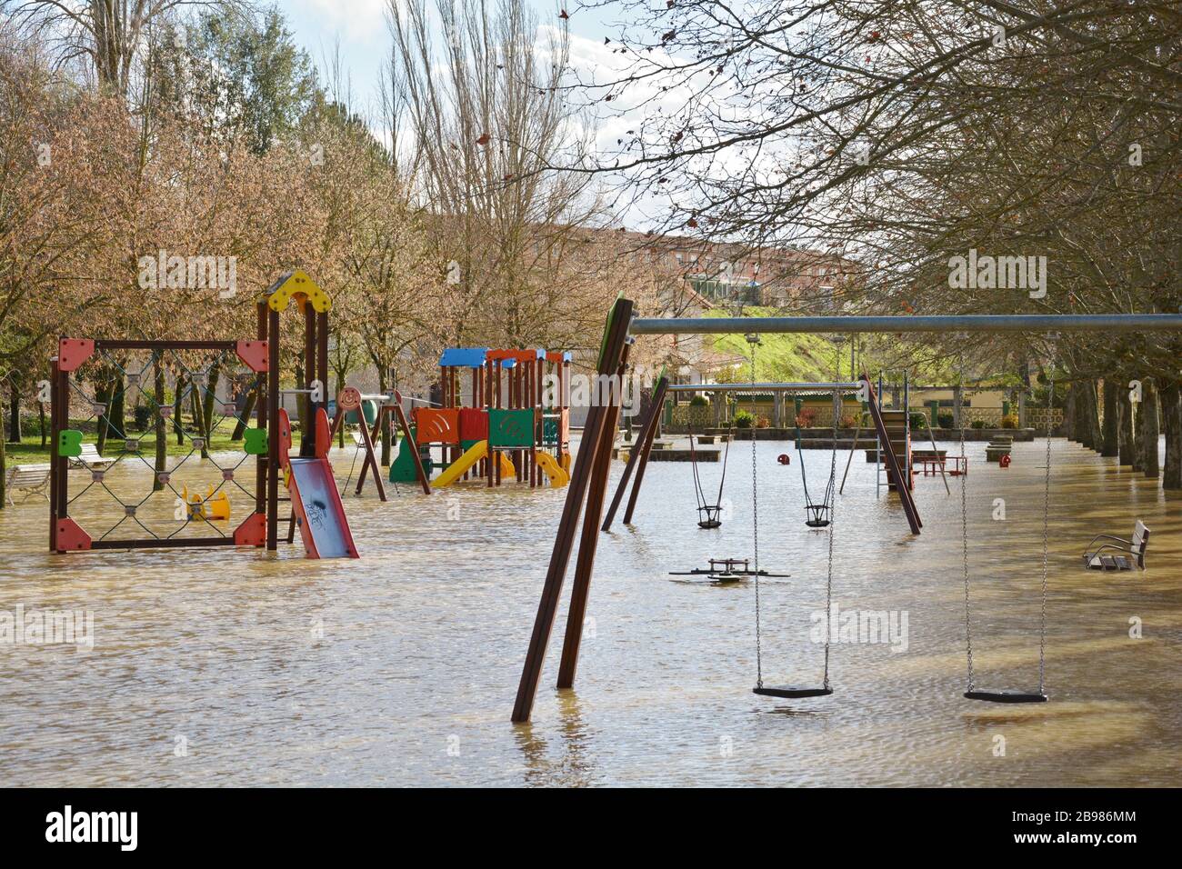 swings in the flooded park Stock Photo - Alamy