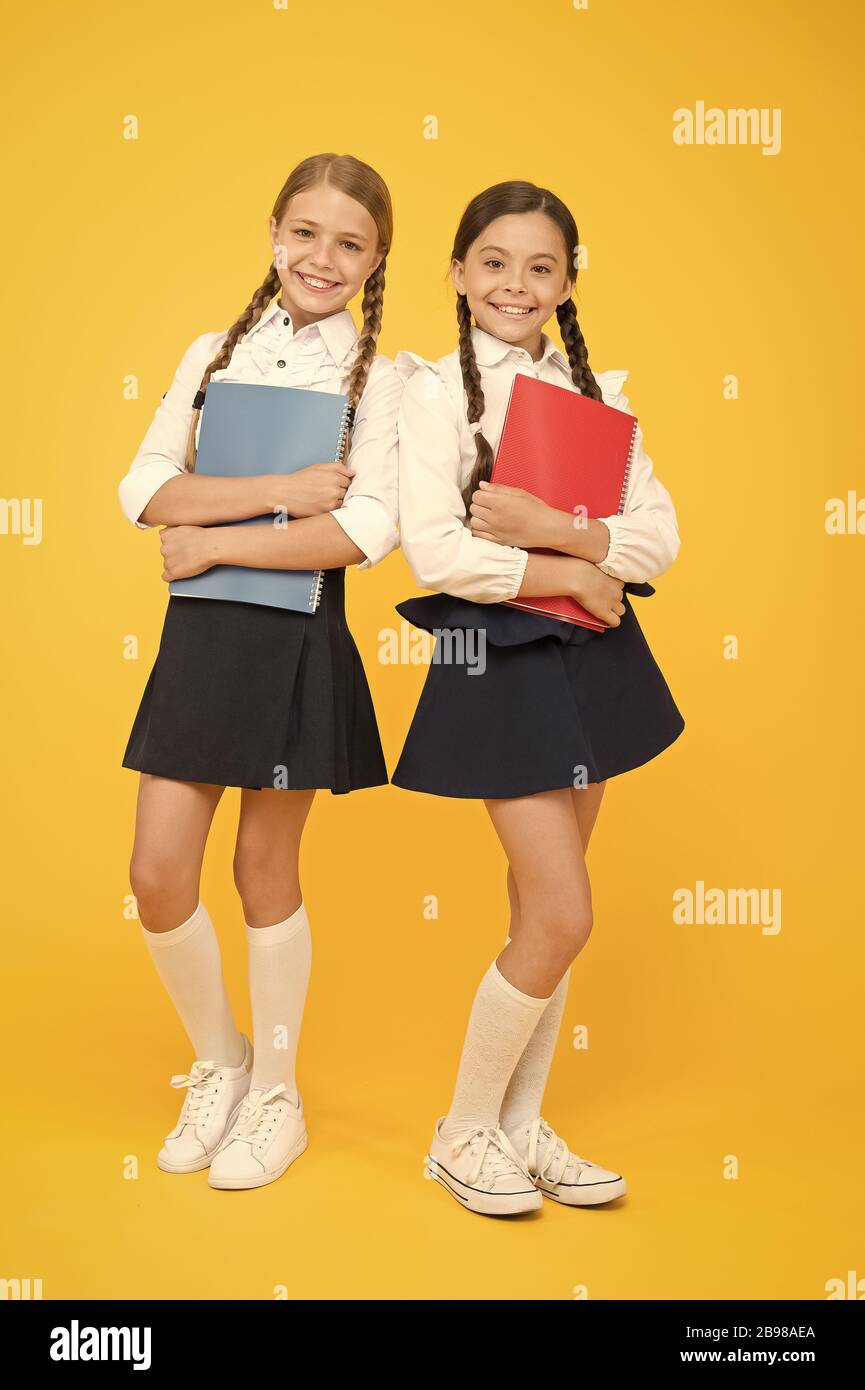 Back to school. Cheerful school girls. Point out positive aspects ...