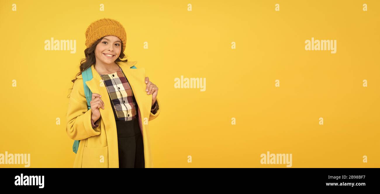 Fall fashion. Little girl wearing stylish hat and coat. Schoolgirl ...