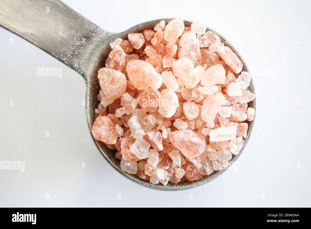 rock salt in measuring spoon Stock Photo - Alamy