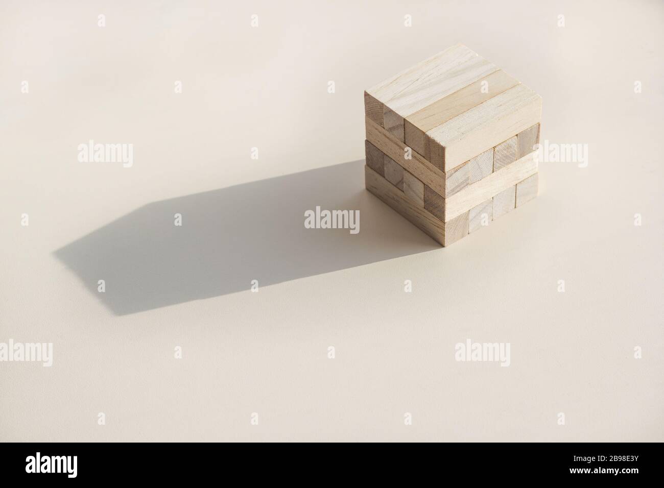 Wood blocks cube game on a white board Stock Photo - Alamy
