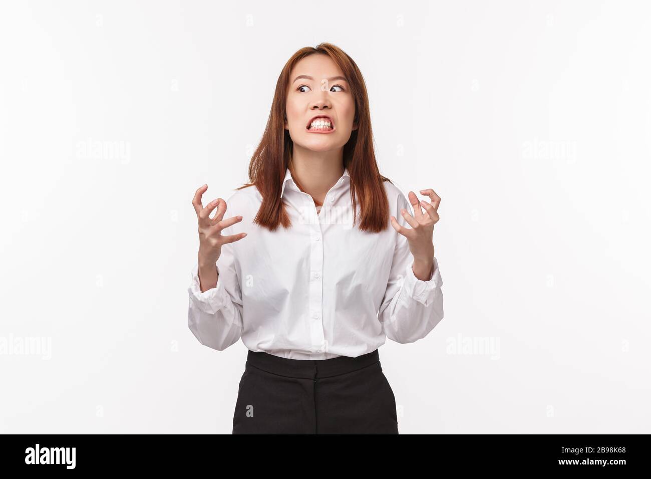 Pissed-off angry asian female office worker losing temper, agressive ...