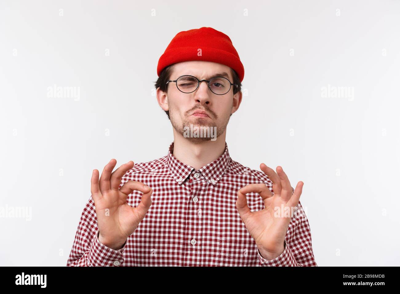 Close-up portrait impressed good-looking young hipster guy in red ...