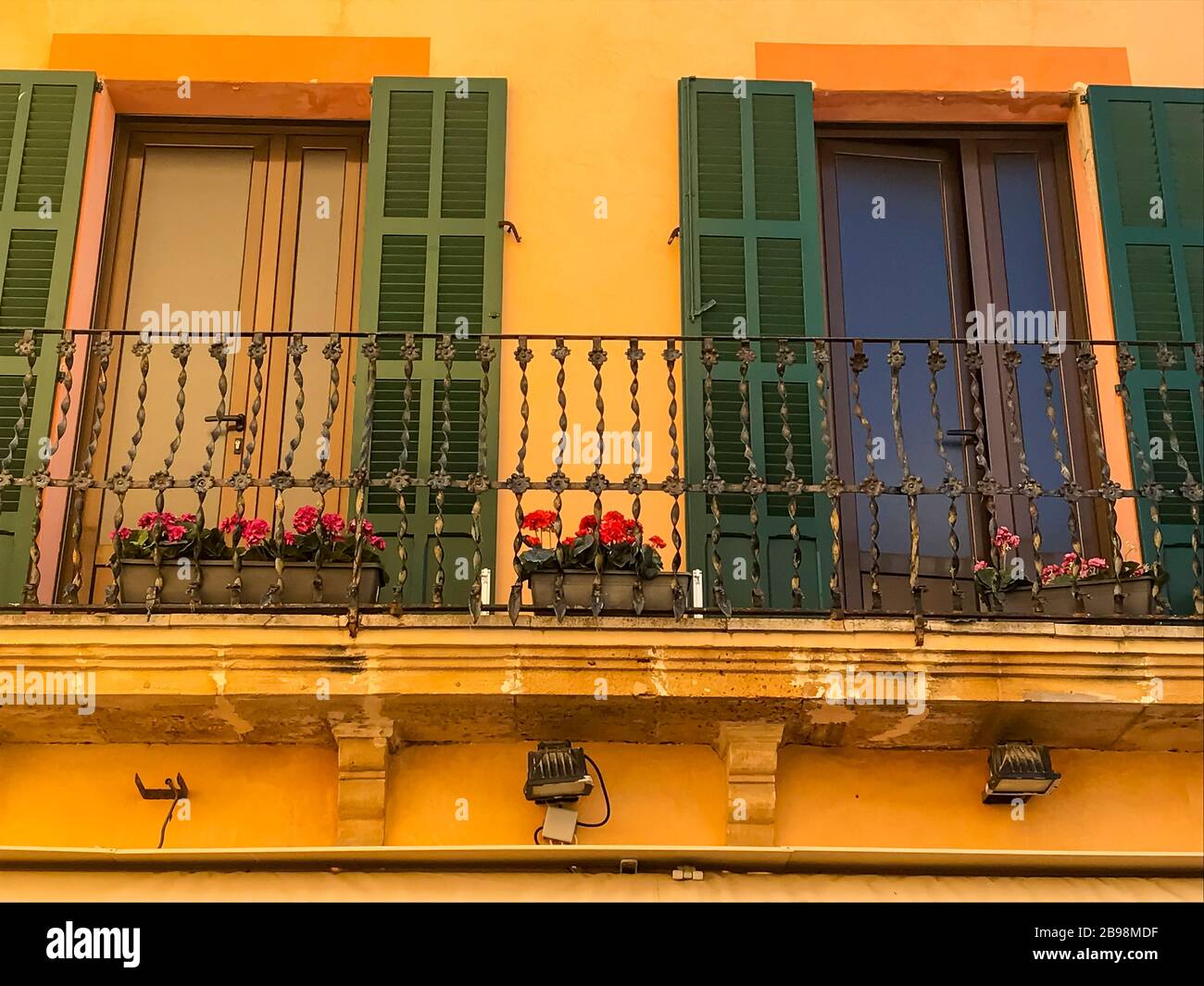 Flowering plants and potted flowers decorating building facades. Studio ...